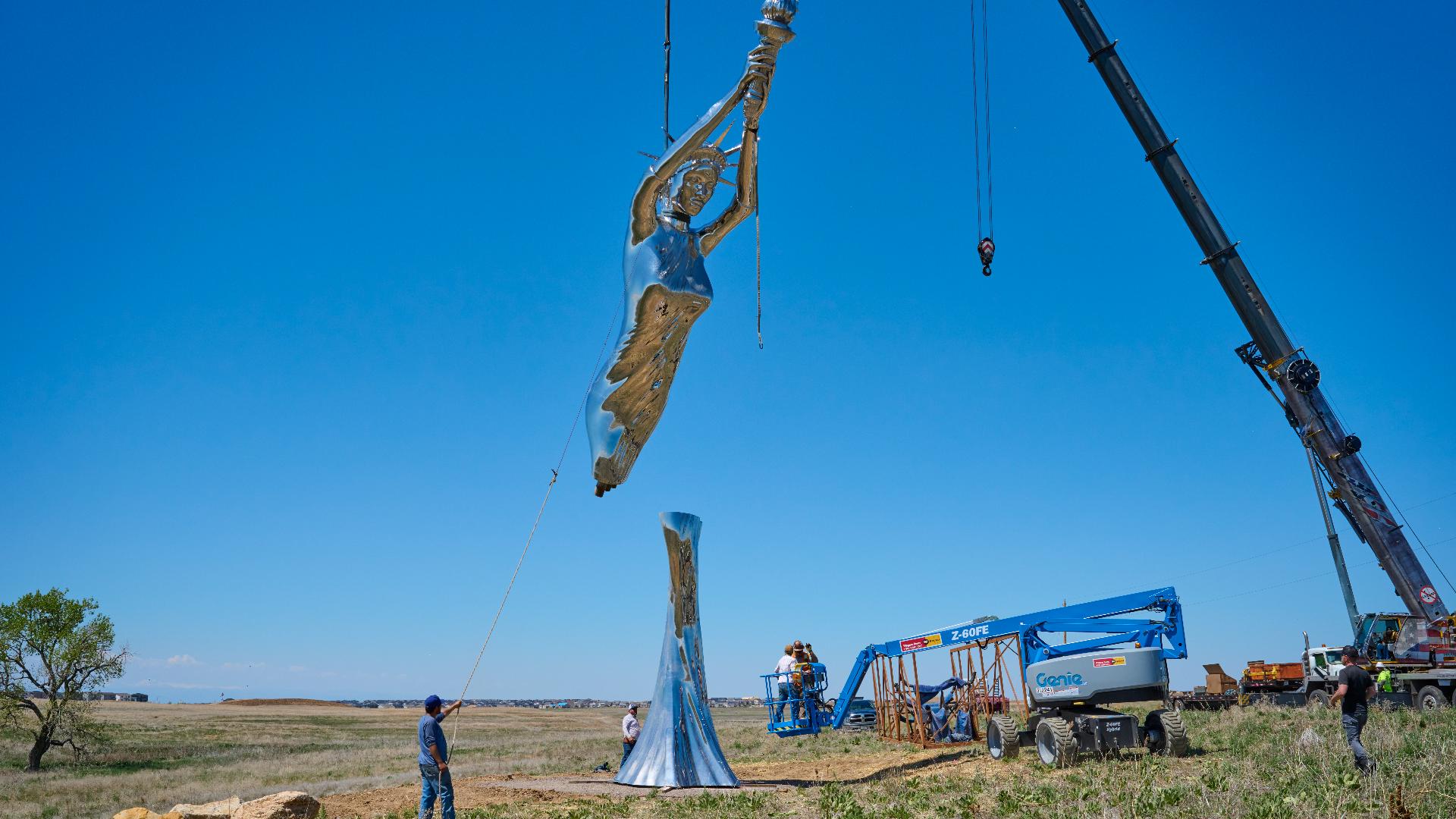 New 58-foot tall 'Liberty' art sculpture installed at The Aurora ...