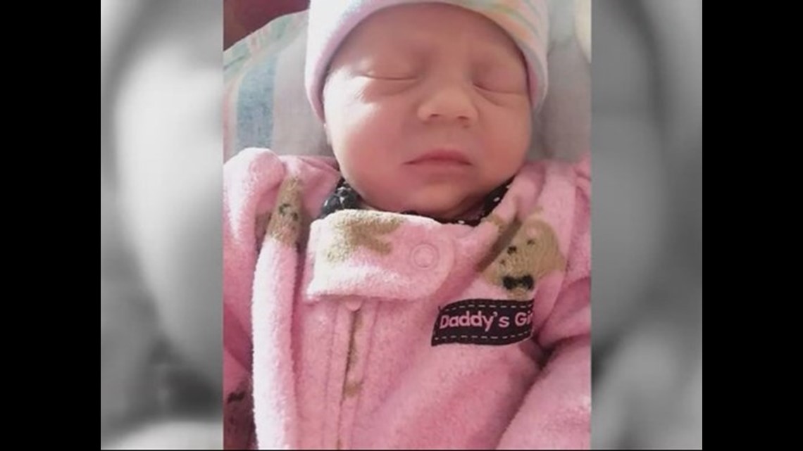 Dad in custody after baby found dead in the woods | 9news.com
